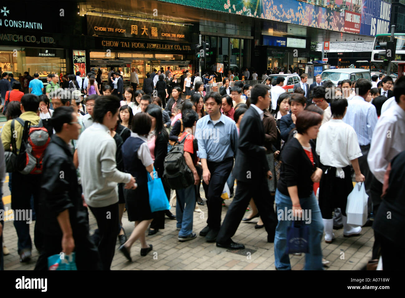 busy and crowded commuter lunchtime streetscene in central business ...