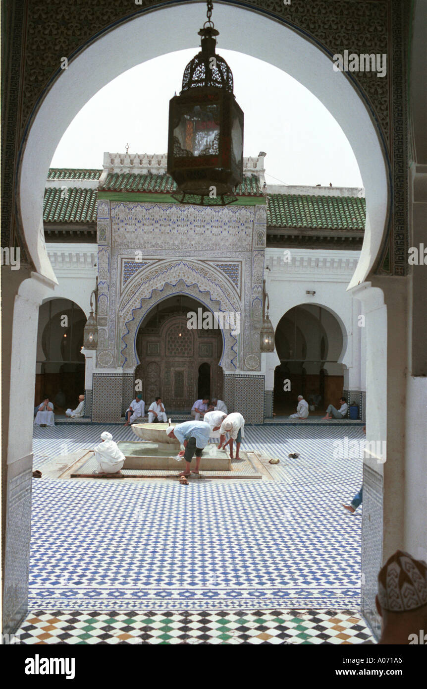 Muslim men performing ablutions in a mosque in Fez before Friday ...