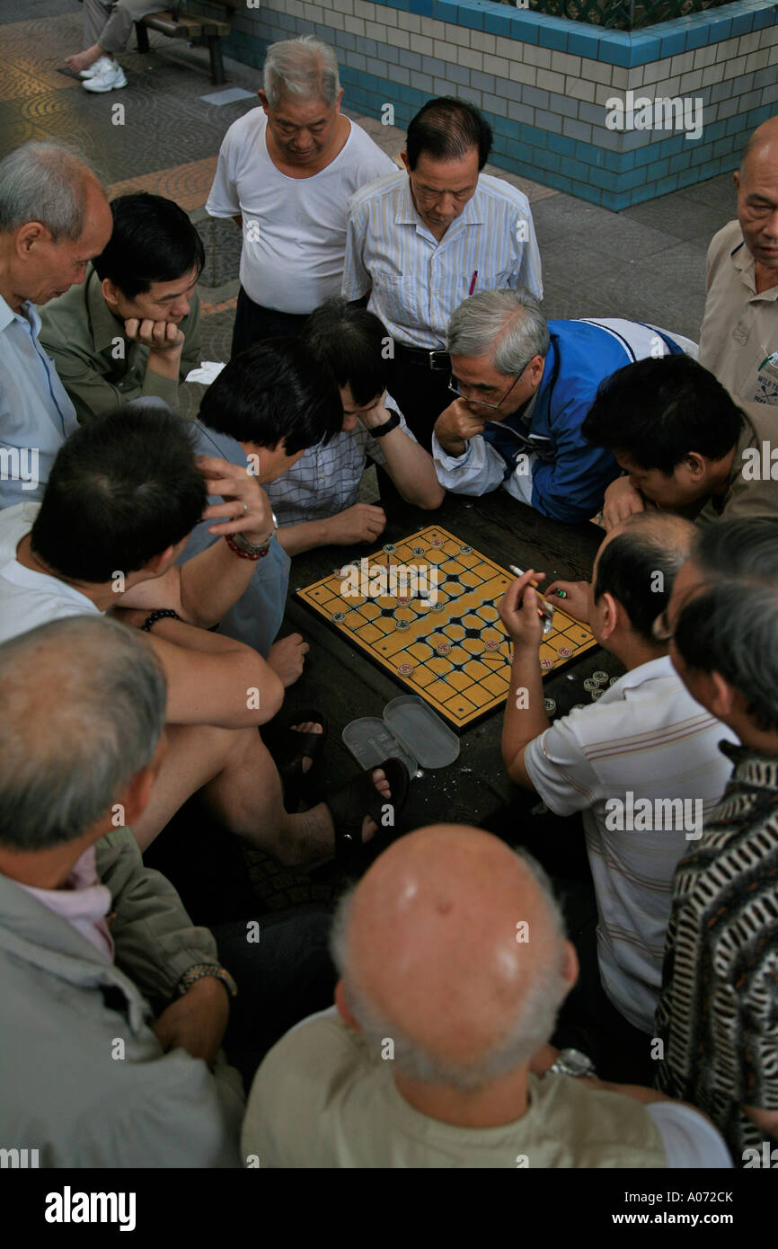 streetscene of chinese men playing chinese chequers in hong kong ...