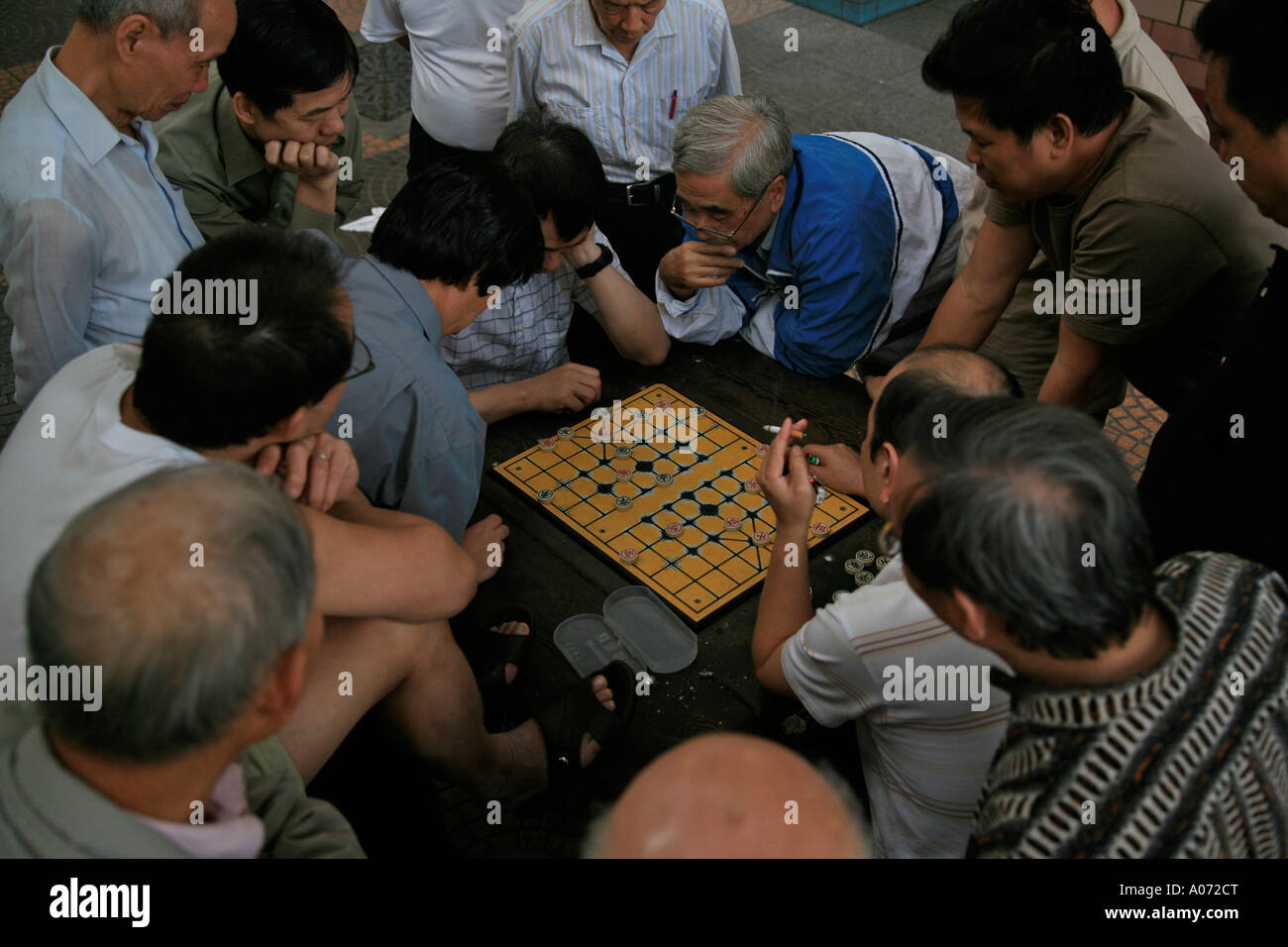 streetscene of chinese men playing chinese chequers in hong kong ...
