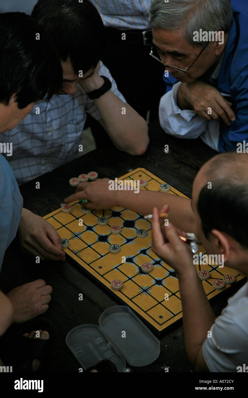 streetscene of chinese men playing chinese checkers in hong kong ...