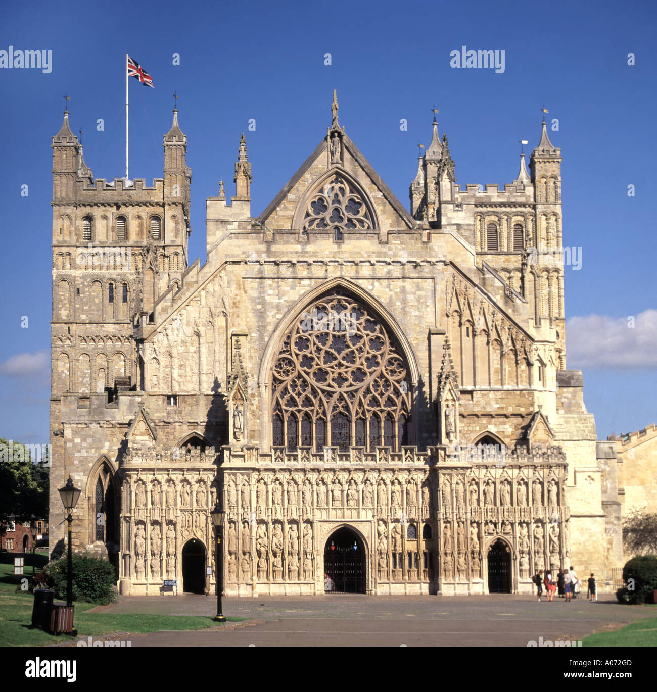 Union flag above Norman Gothic architecture of the West Front & towers ...