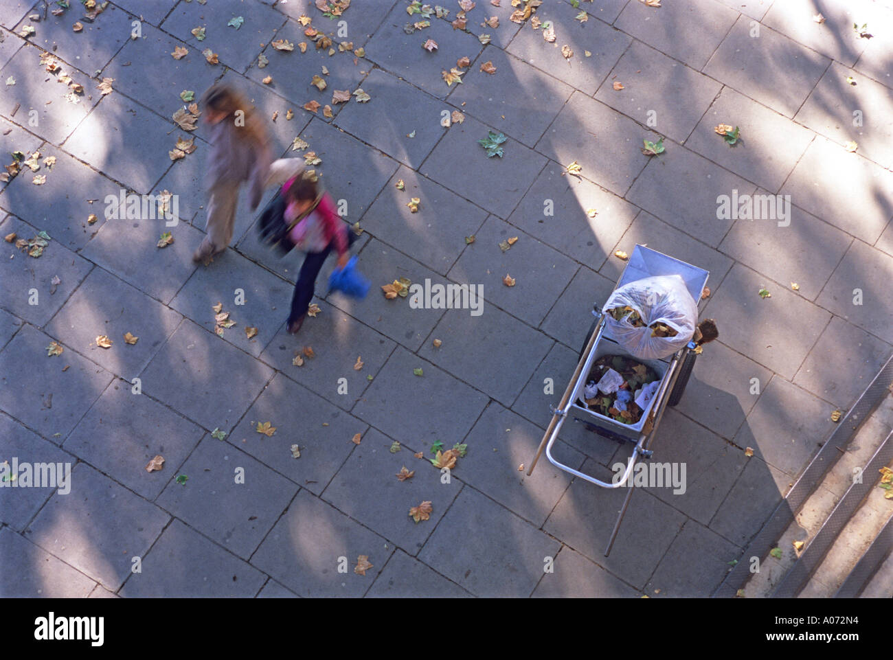 "Street sweeper's cart, pedestrians, London Stock Photo - Alamy
