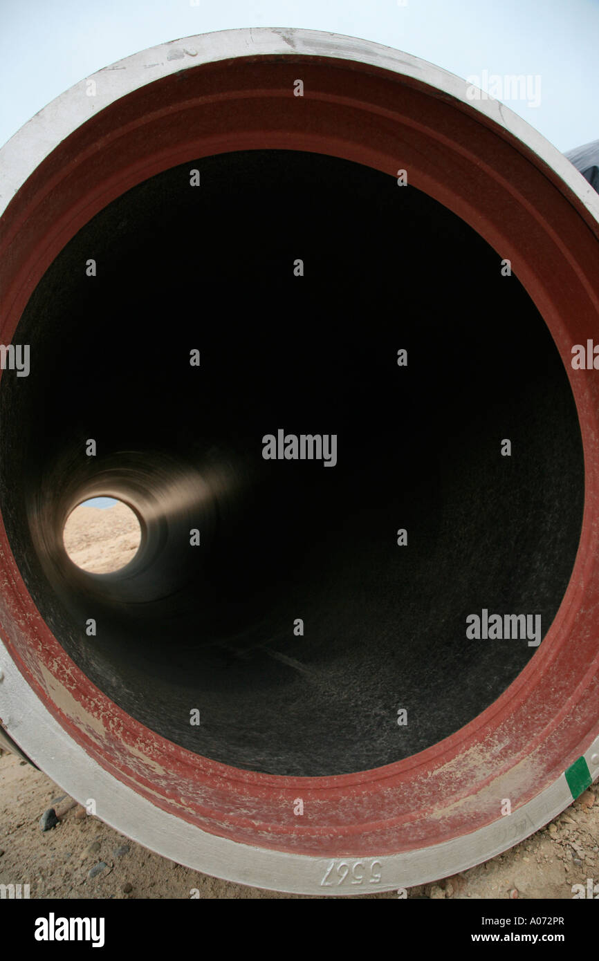 Industrial oil pipes ready to put in ground and connected together in ...