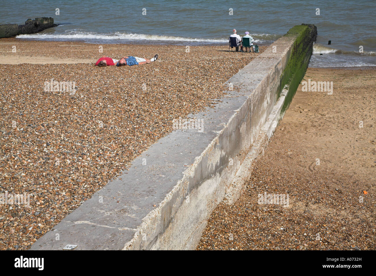 Groyne and longshore drift Felixstowe beach Suffolk England Stock Photo ...