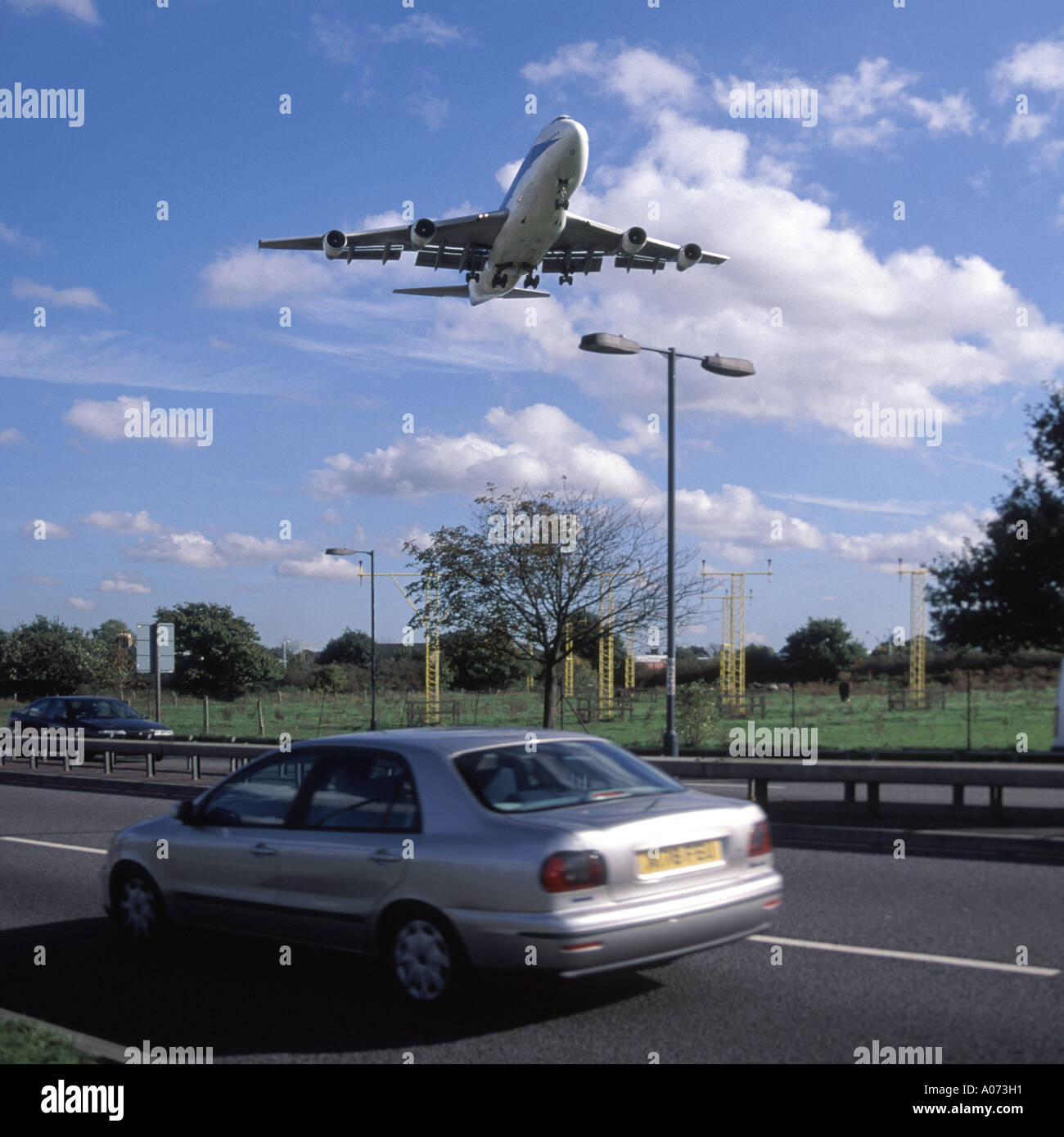 London Heathrow airport low flying jet airliner on landing approach ...