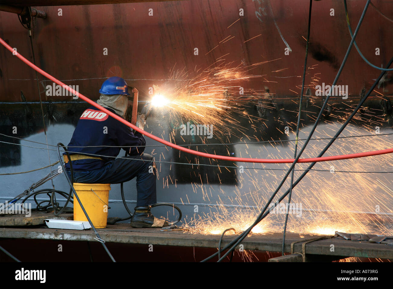 graphic detail shot of ship welder and ship welding painting protective ...