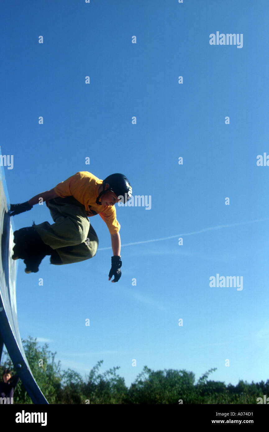 roller skating on ramp outside boy play Stock Photo - Alamy