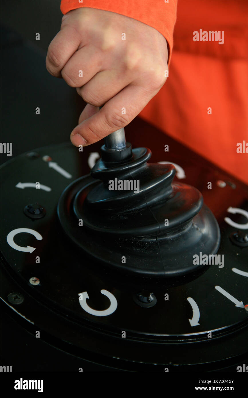 Graphic shot of Tugboat captain using controls whilst manoevering by ...