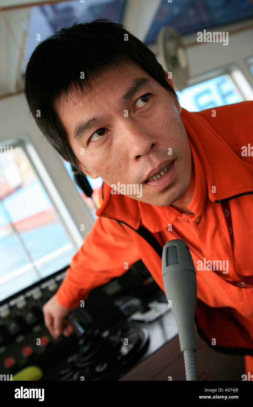 Tugboat captain directing operations containership in Kwai Chung ...