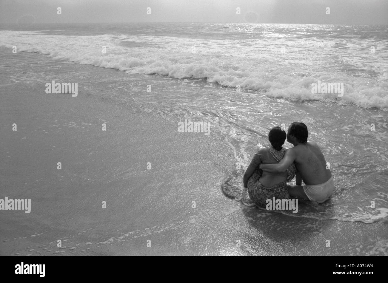 Couple embracing bathing at beach Puri Orissa Odisha India Asia MR#313 ...