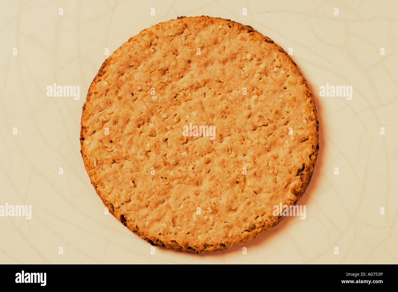 Oatcake on a white ceramic background Stock Photo - Alamy