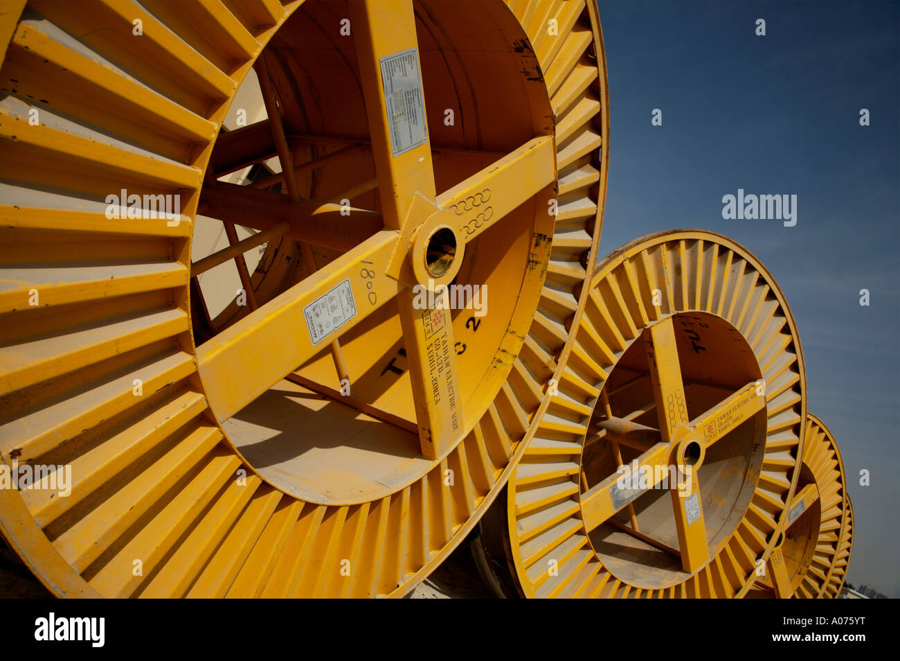 Graphic shot of large electricity power cable spools in dubai uae ...