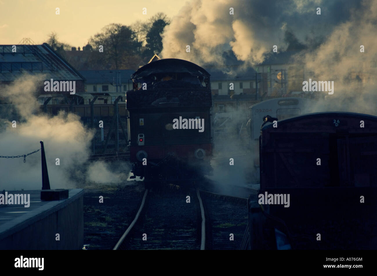 Steam engine surrounded by smoke and steam Stock Photo - Alamy