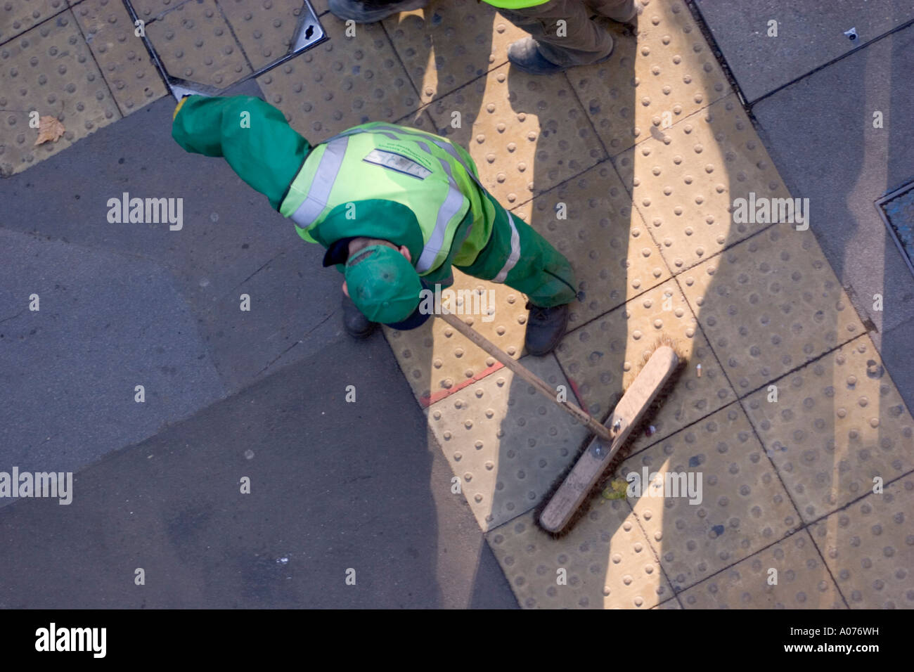 City of London street cleaner road sweeper roadsweeper sweeping leaves ...