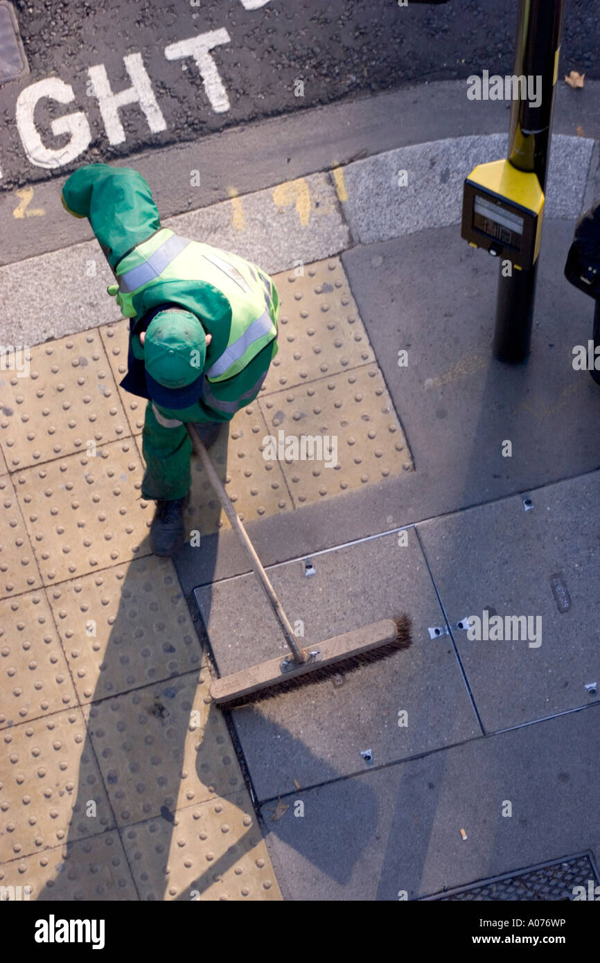 City of London street cleaner road sweeper roadsweeper sweeping leaves ...