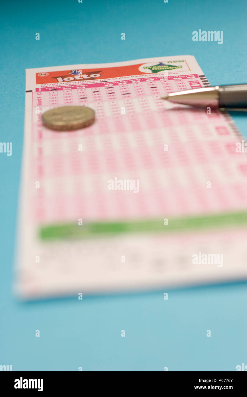 UK Lotto National Lottery play slip entry form with pound sterling coin ...