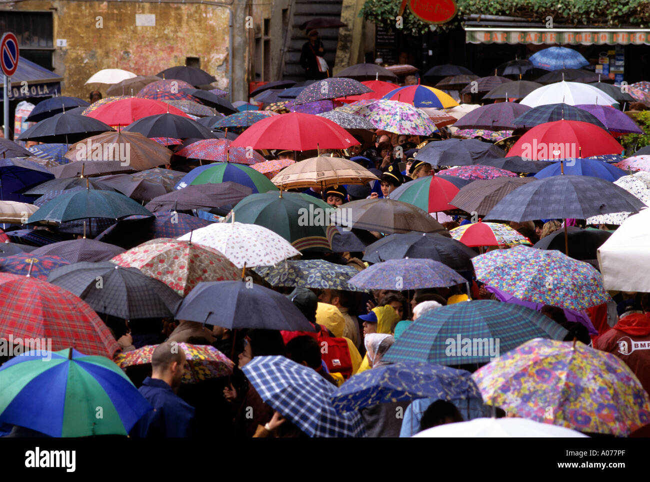 A crowd of people using umbrellas at a festival in Camogli, Italy Stock ...
