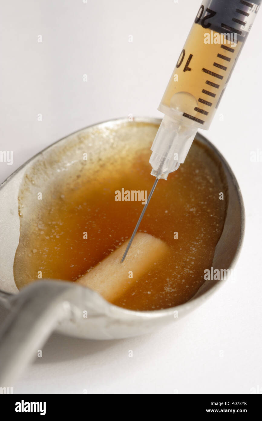 Heroin preparation in a spoon with needle Stock Photo - Alamy