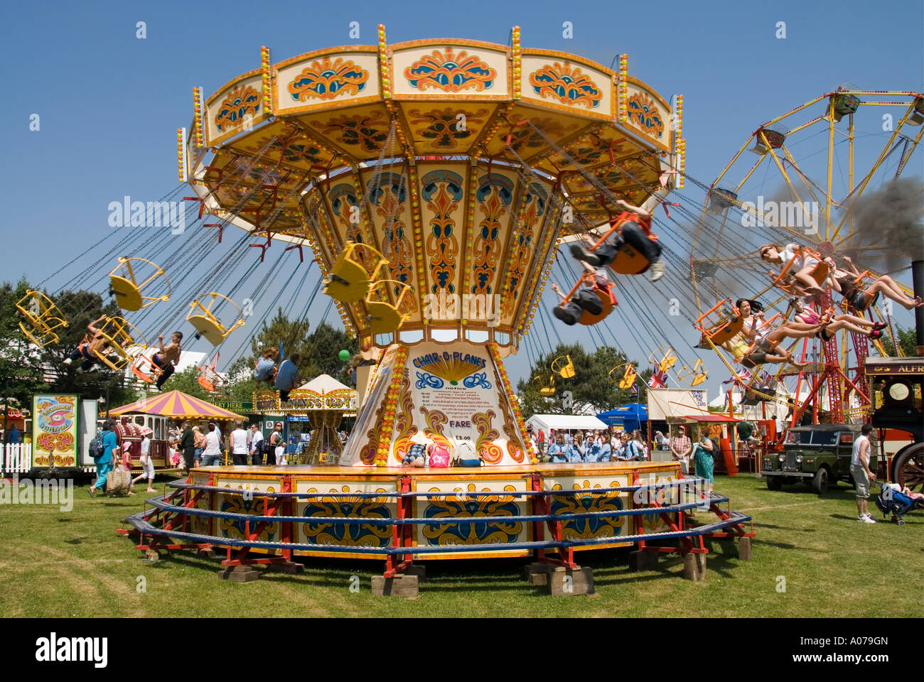 Kids on chair ride at fairground Stock Photo - Alamy