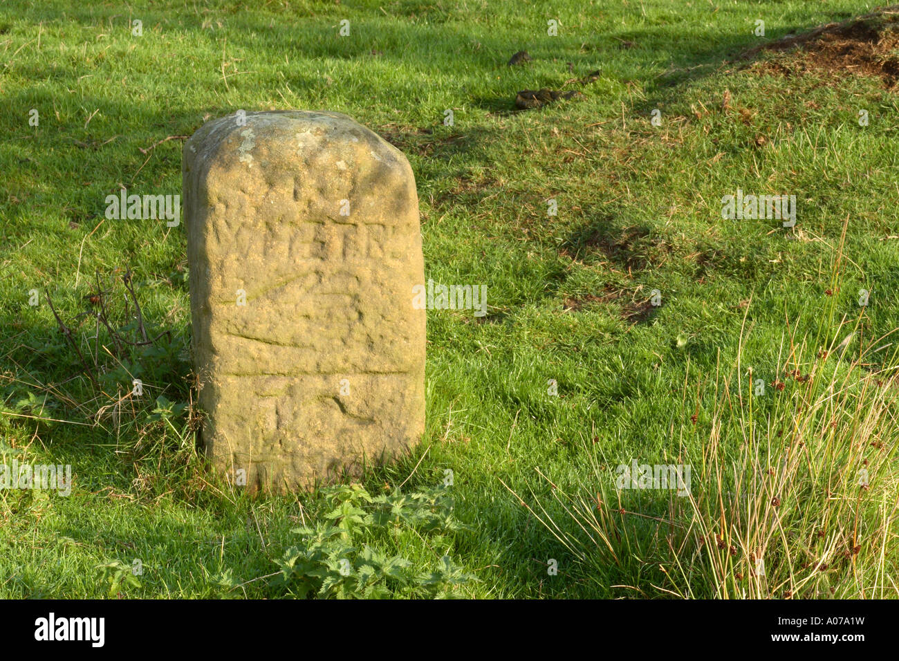 Ancient route marker signpost carved stone with hand symbol Stock Photo ...