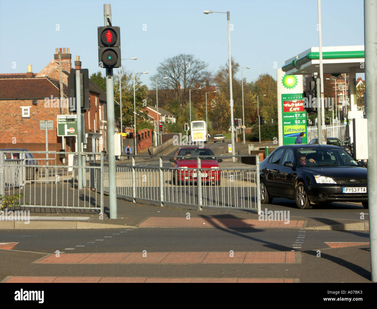 Road Junction with pedestrian crossing. Two cars on the road Stock ...