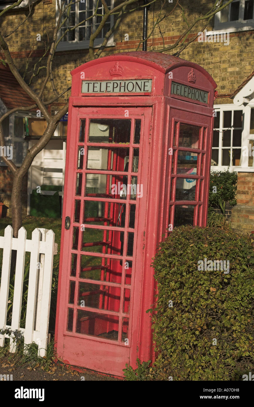 Faded Red Telephone Box In Rural British Village Stock Photo - Alamy