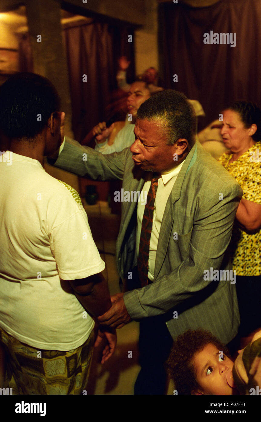 Protestant preacher at a revival meeting. Low income community in a Rio ...