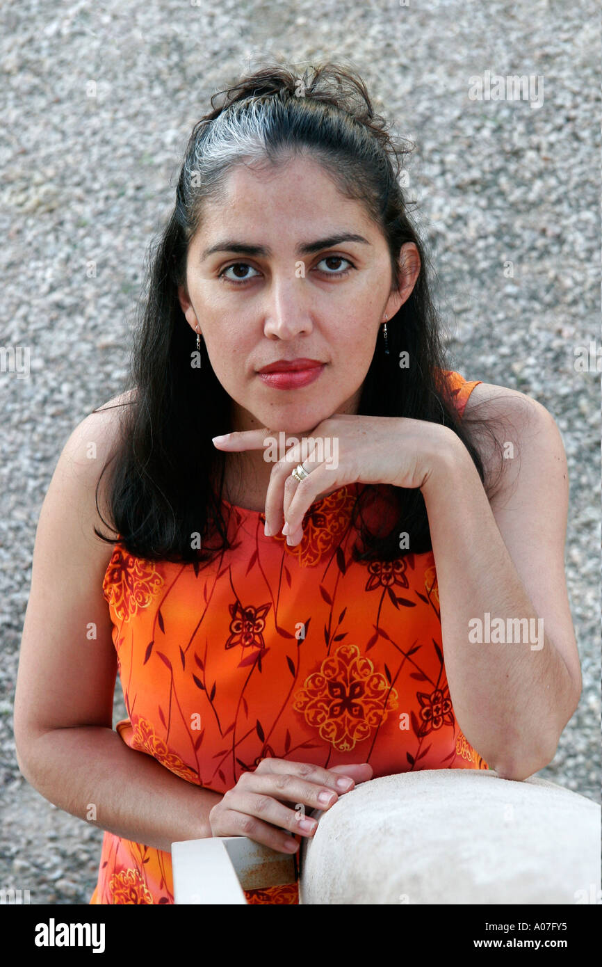 Beautiful Mexican Woman Gazing with hand under her chin Stock Photo - Alamy
