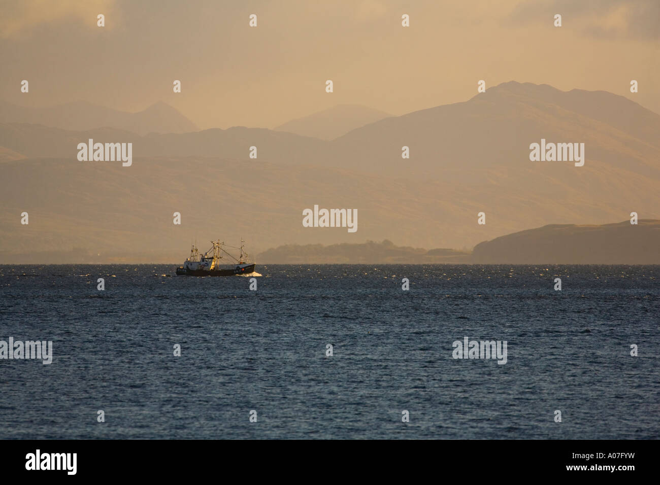 Landscape of fishing Boat at dawn, Sound of Mull, Scotland, United ...