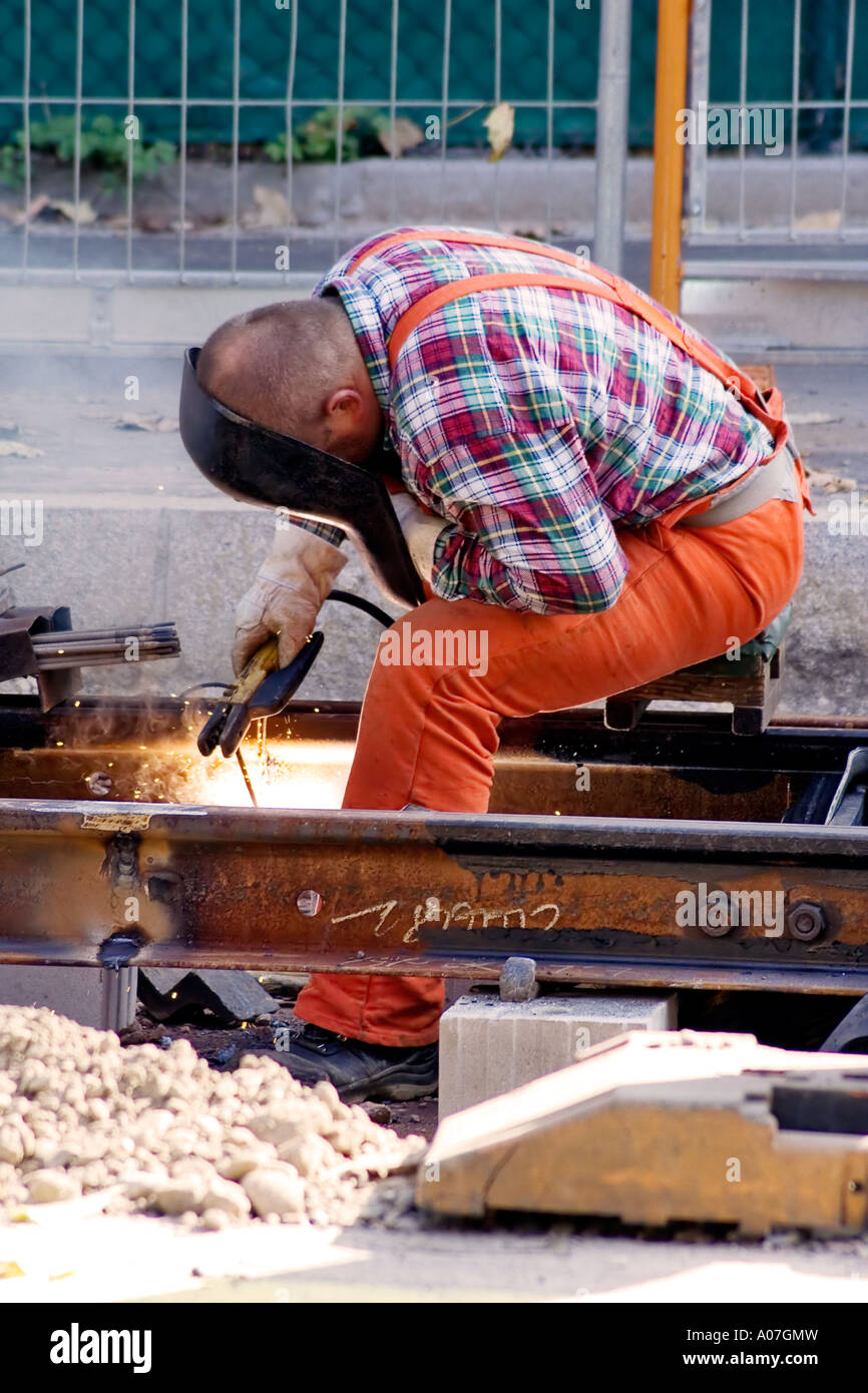 Construction Worker Fixing Rails (Portrait Stock Photo - Alamy