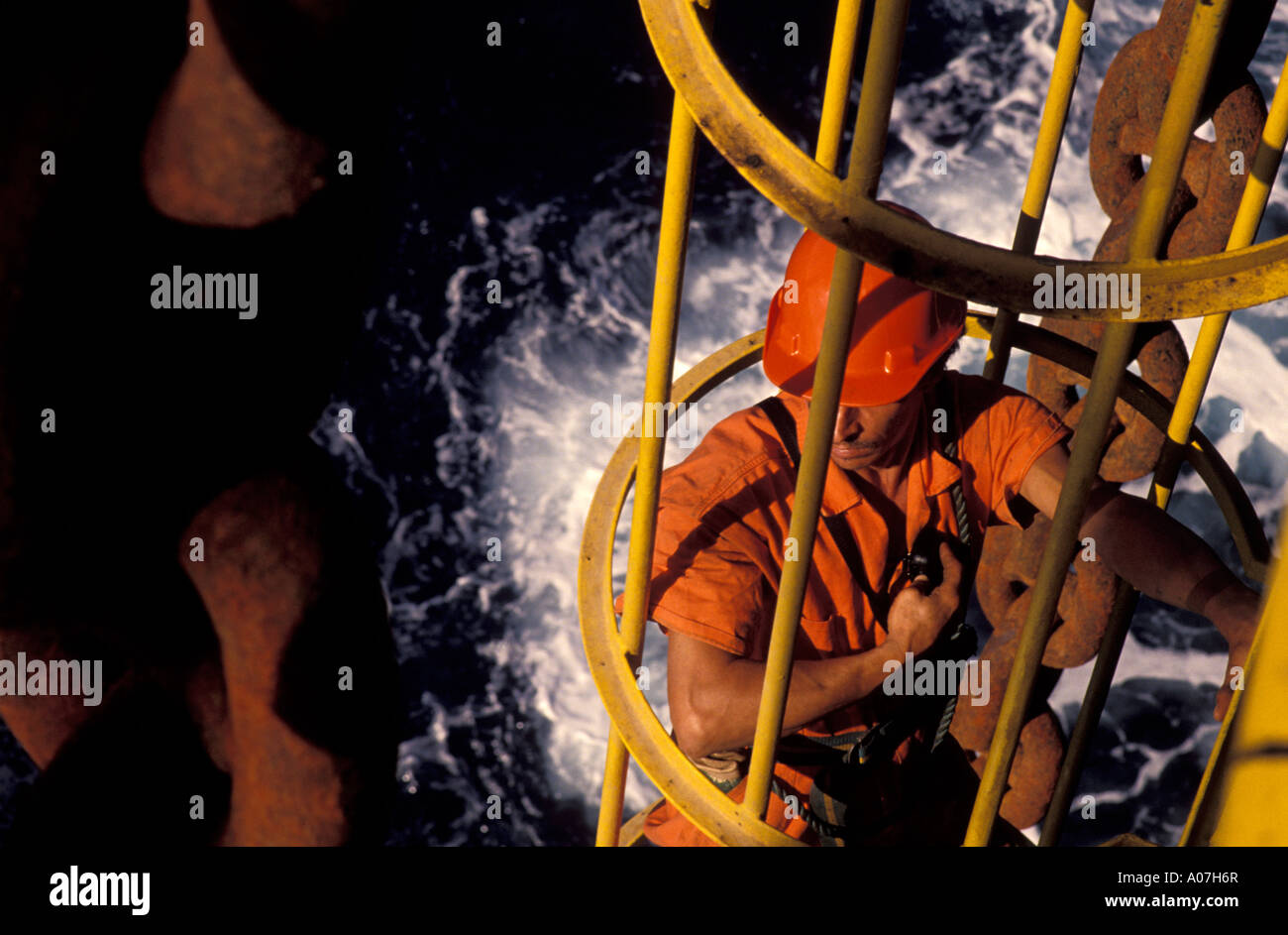 Petroleum platform worker. Occupational safety and health. Steel chain ...