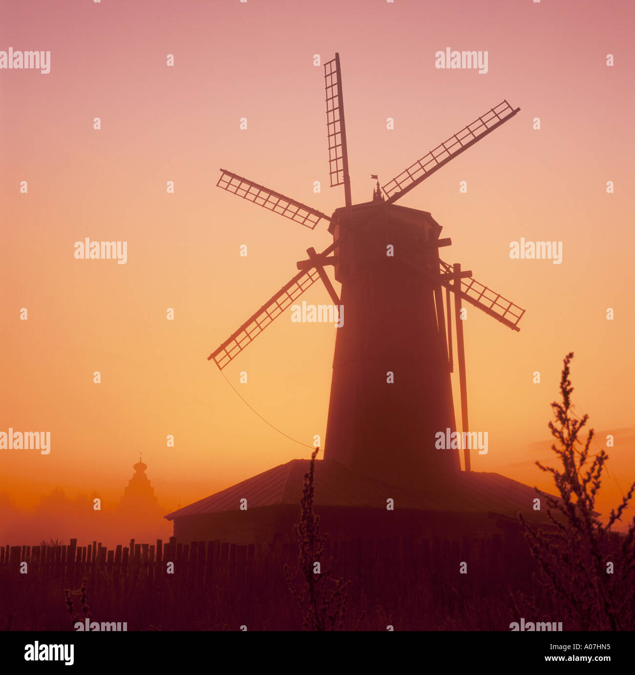 Old windmill and Russian church at dawn and first morning frost and old ...