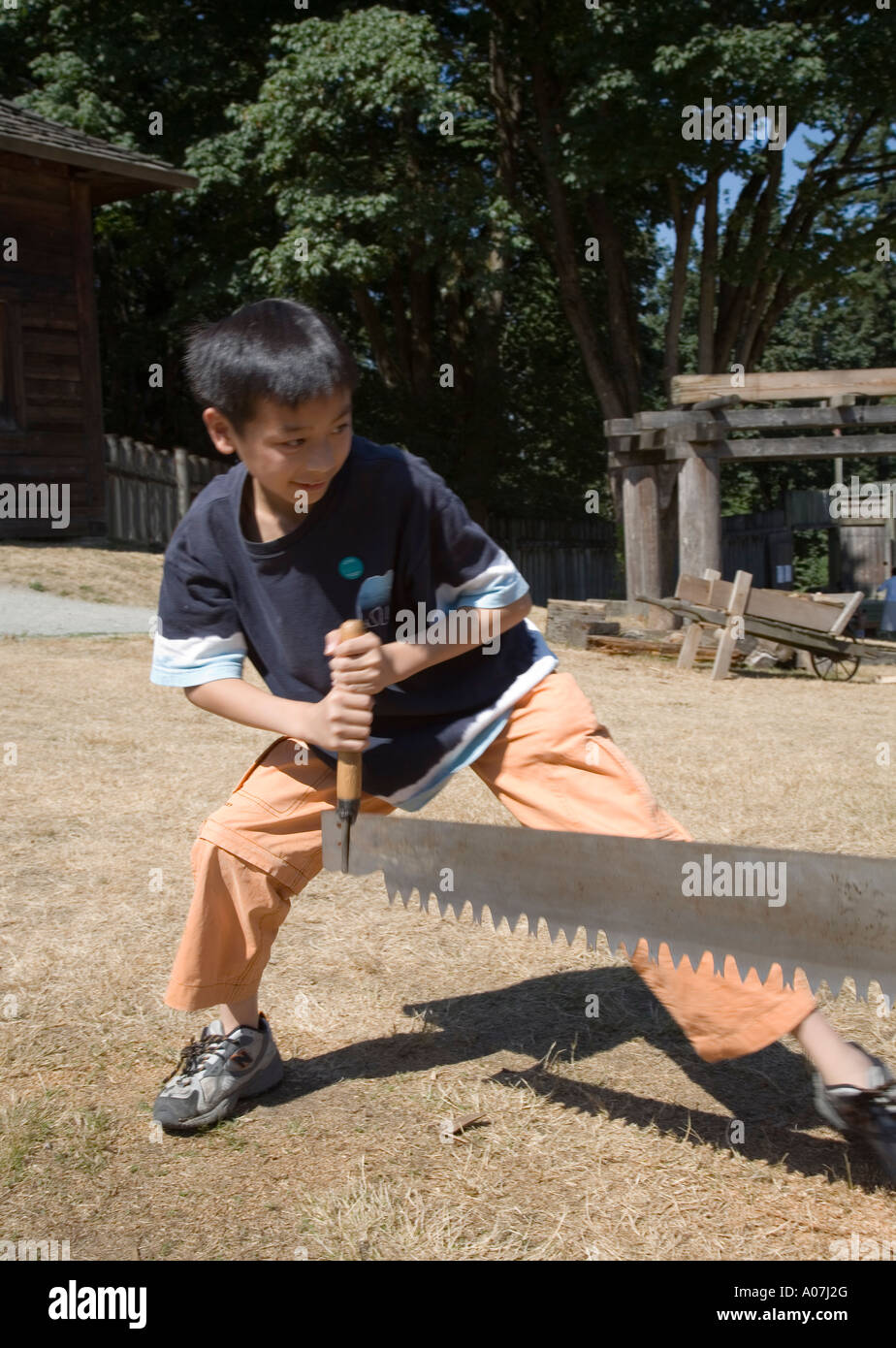 Boy with saw hi-res stock photography and images - Alamy