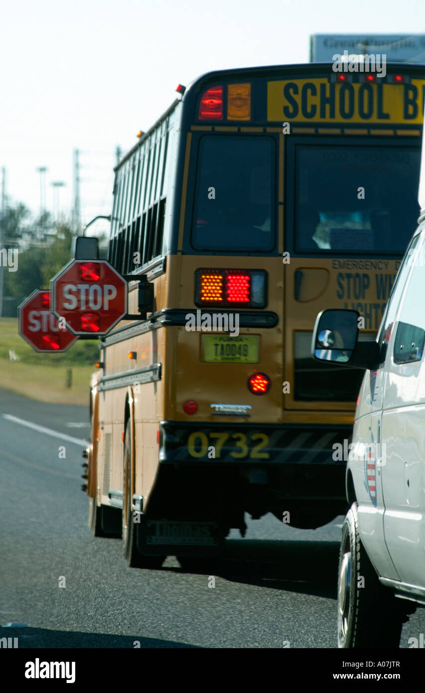 Yellow school bus showing stop signals. USA Stock Photo - Alamy