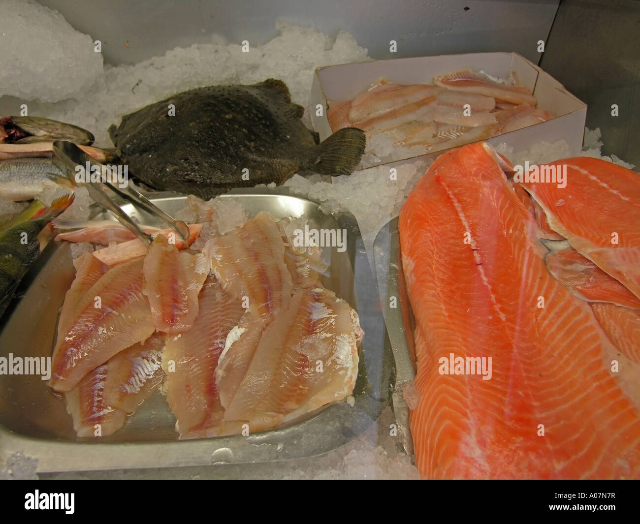 fish for sale on a fish stand Stock Photo - Alamy