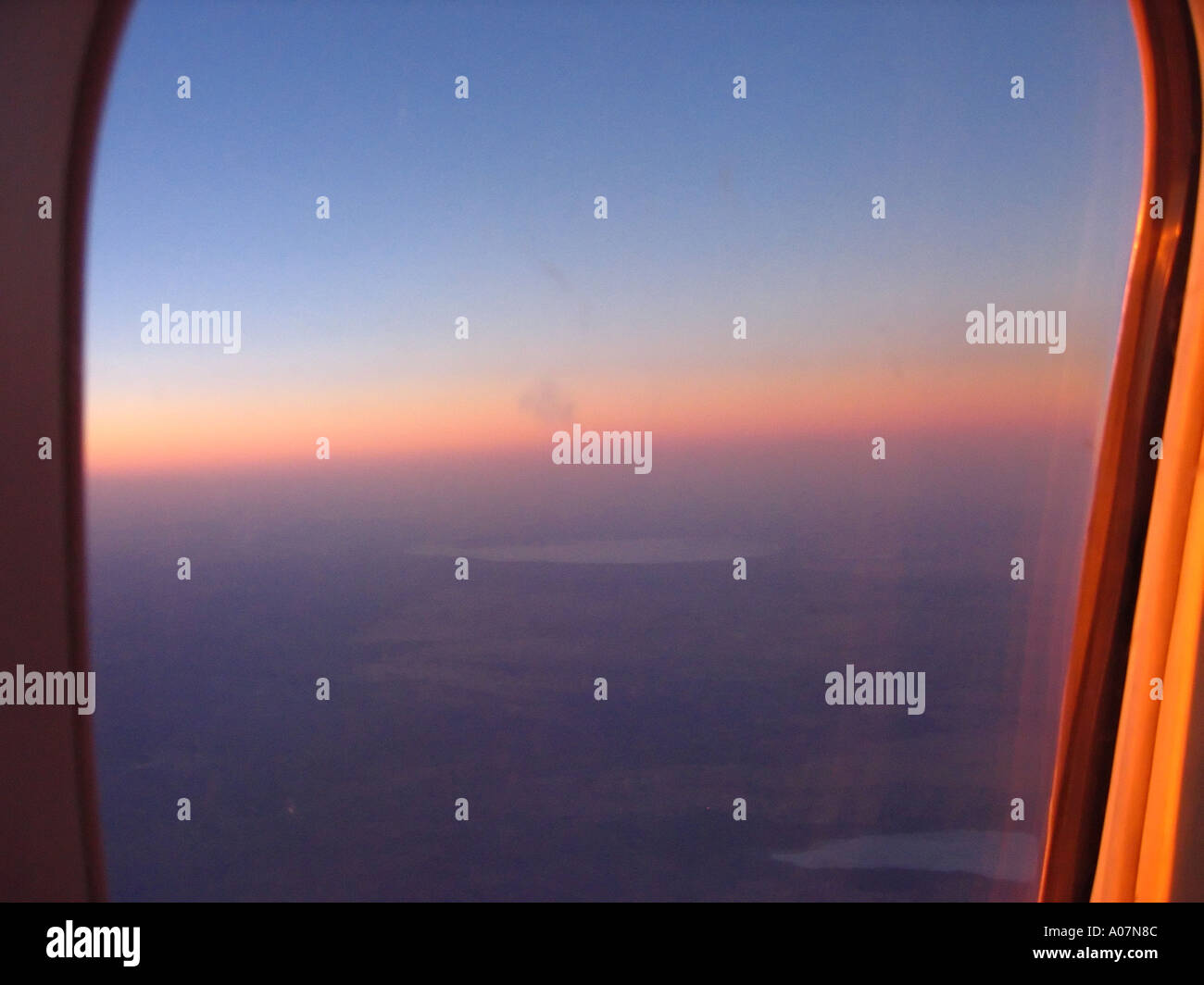 sunset seen from window of plane Stock Photo - Alamy