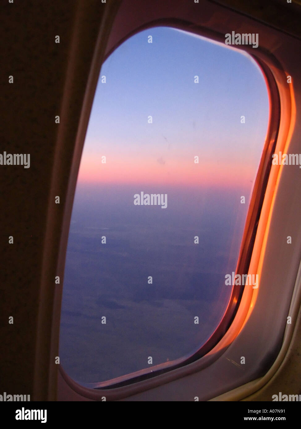 sunset seen from window of plane Stock Photo - Alamy