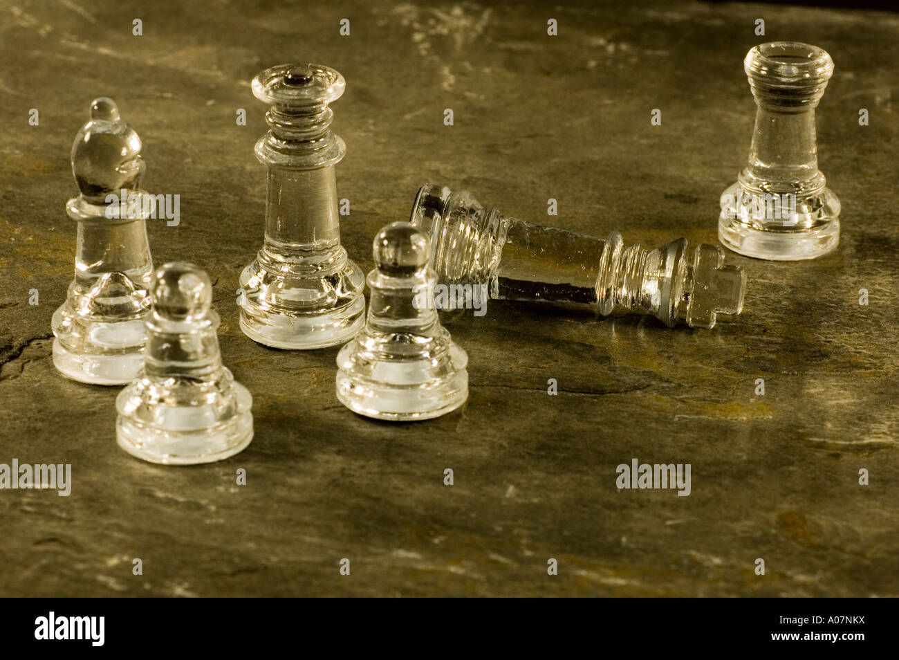 Glass King Chess Piece Laying on side on Slate base surrounded by other ...
