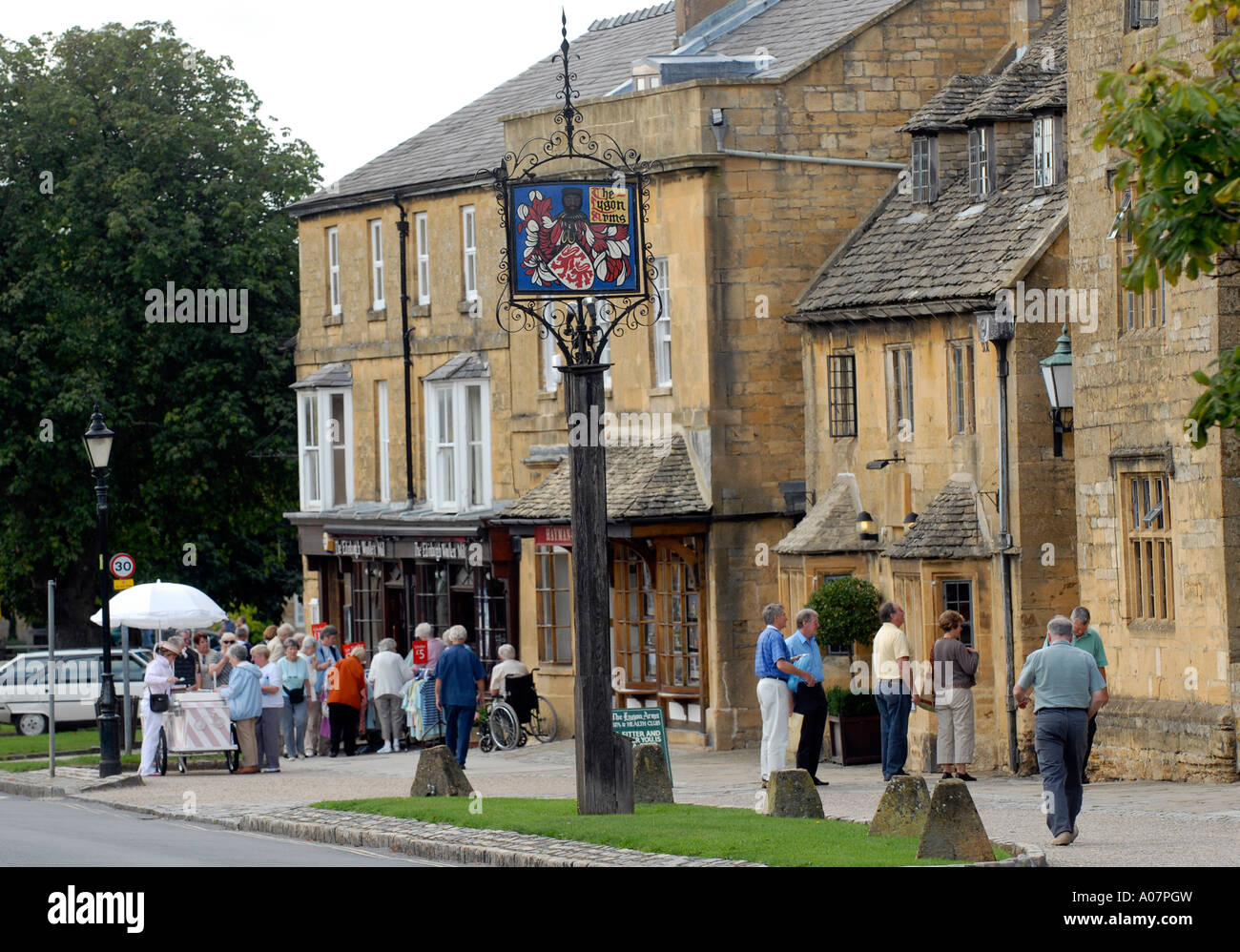 People queuing for ice cream outside The Lygon Arms Broadway Village in ...