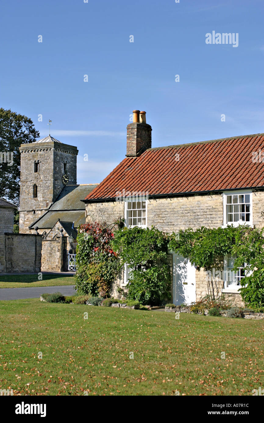Hovingham North Yorkshire UK Cottage and Parish Church Stock Photo - Alamy