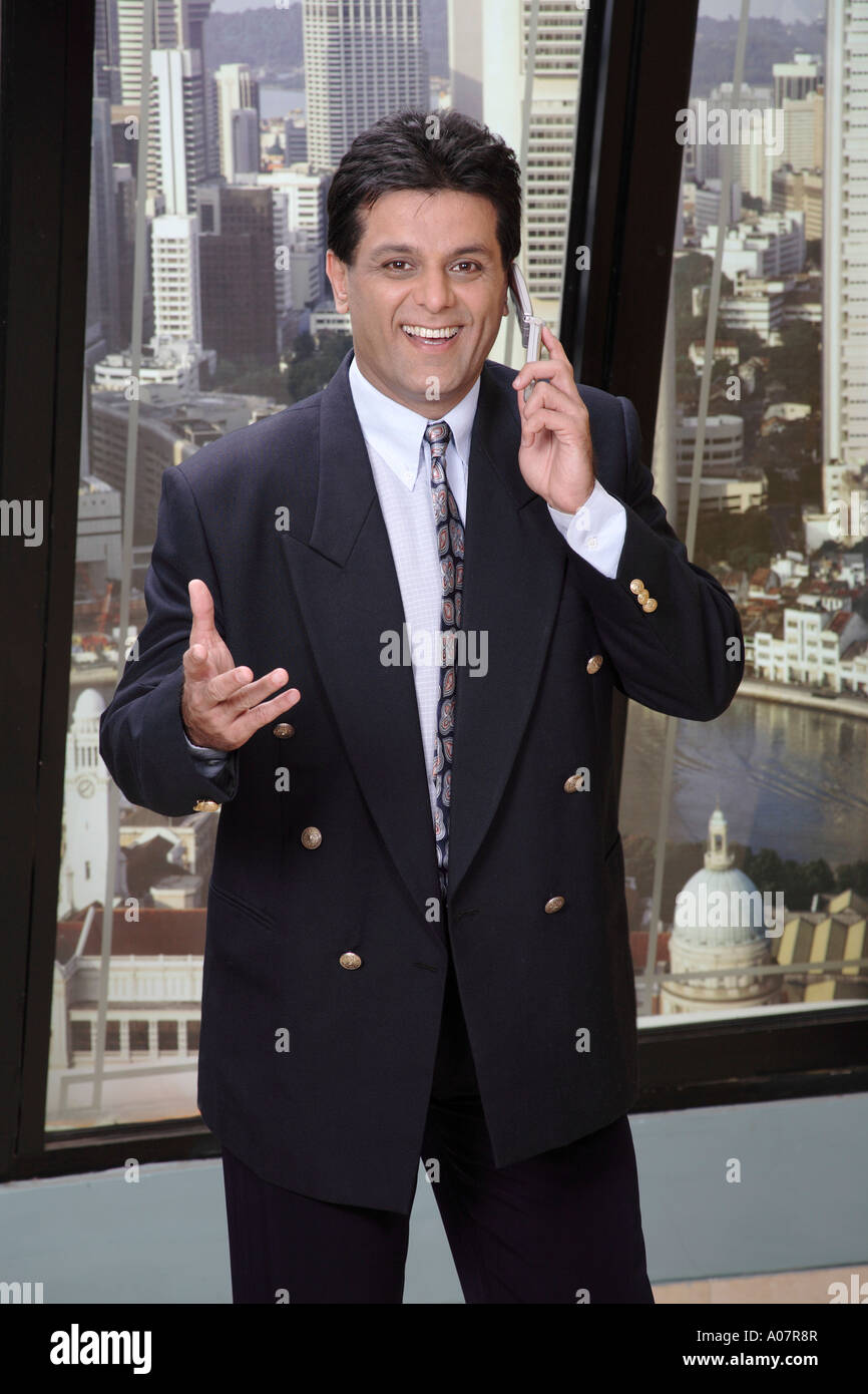 CEO talking on mobile phone in his cabin in business suit Stock Photo ...