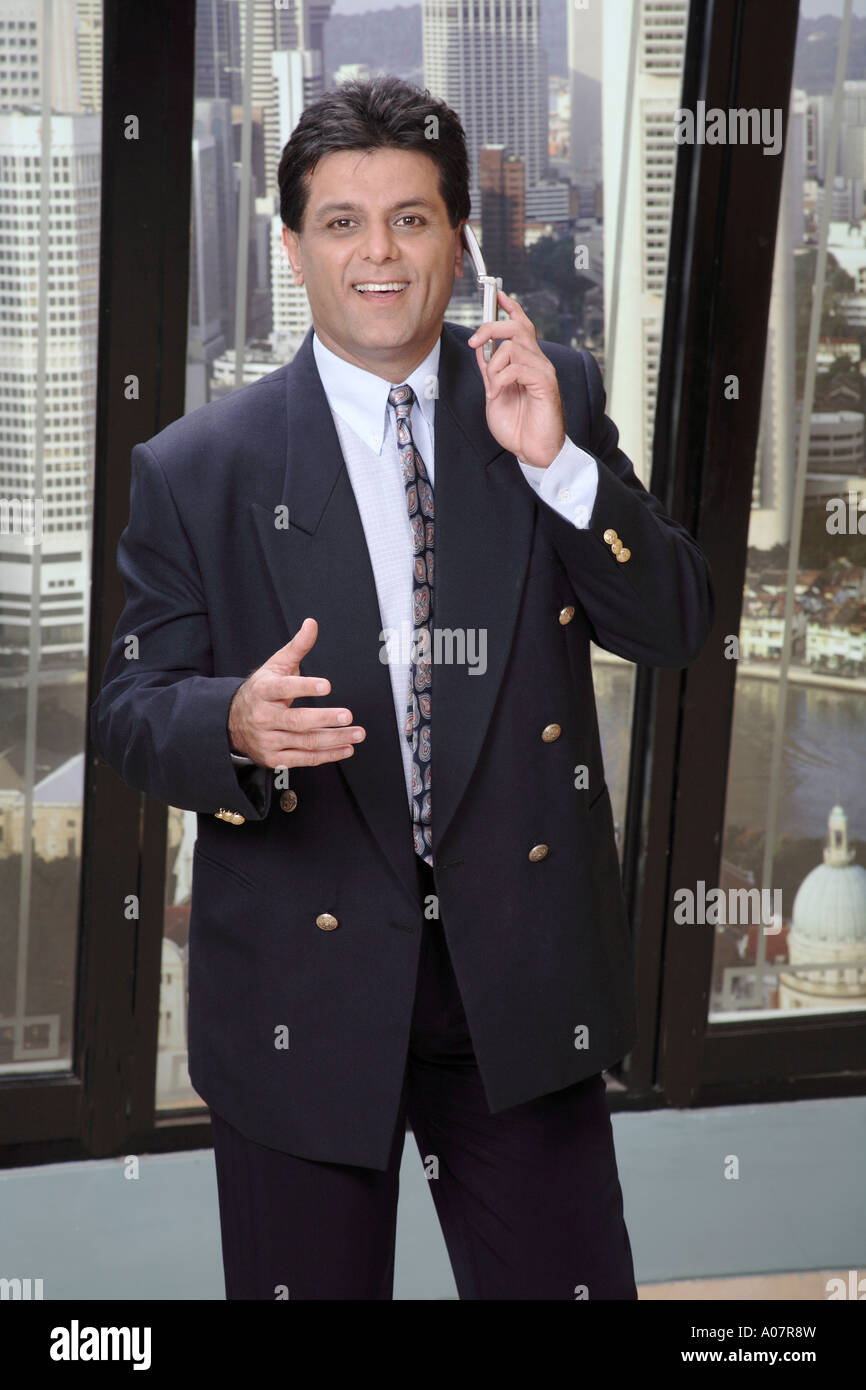 CEO talking on mobile phone in his cabin in business suit Stock Photo ...