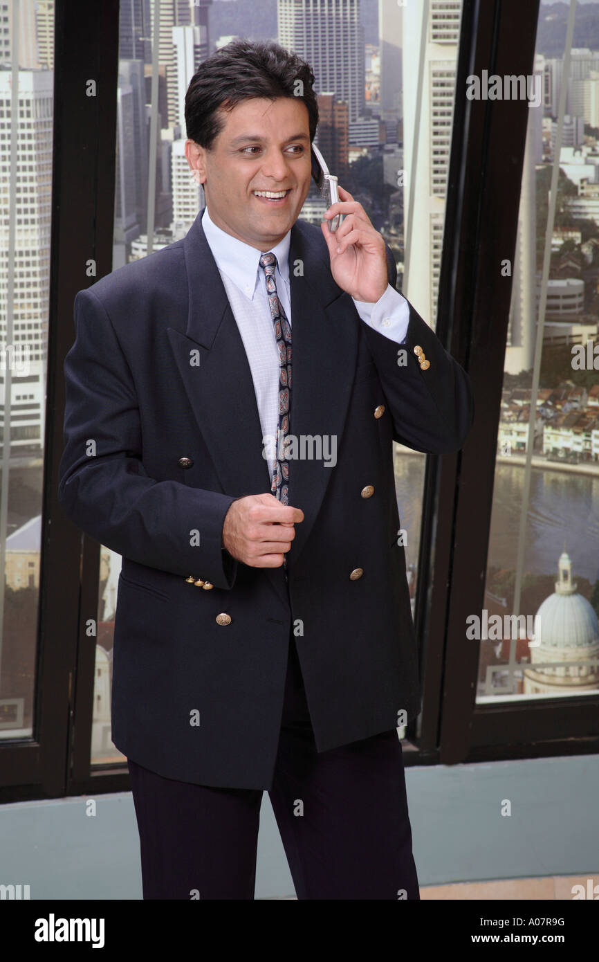 CEO talking on mobile phone in his cabin in business suit Stock Photo ...