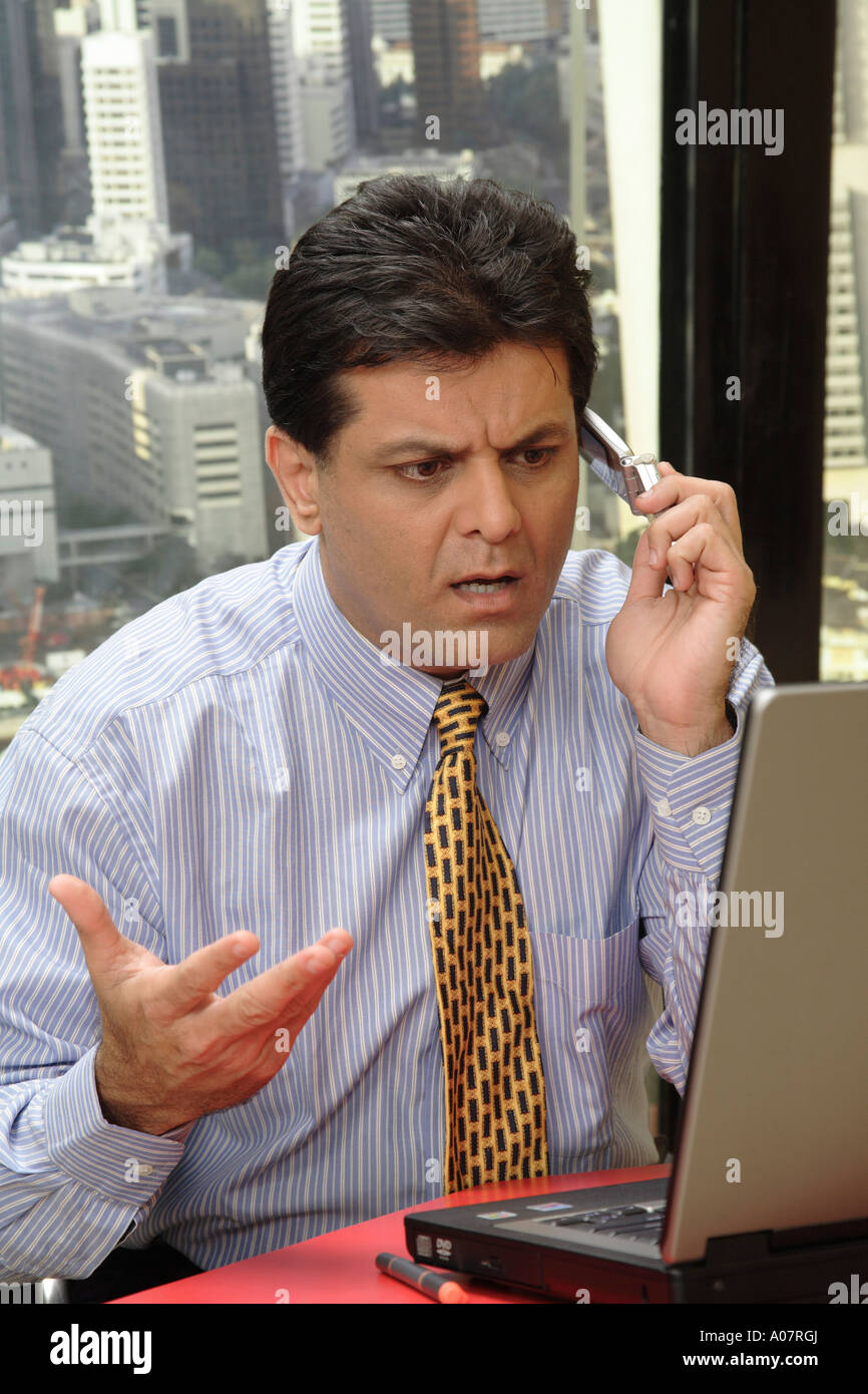 CEO worried seeing message on laptop computer in his cabin Stock Photo ...