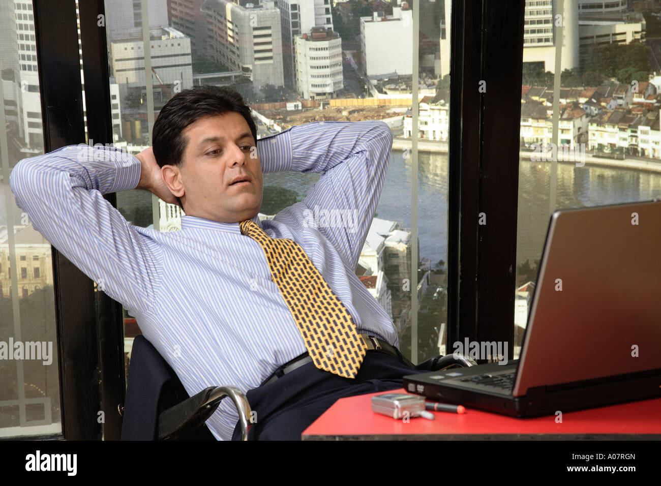 CEO thinking seeing message on laptop computer in his cabin Stock Photo ...