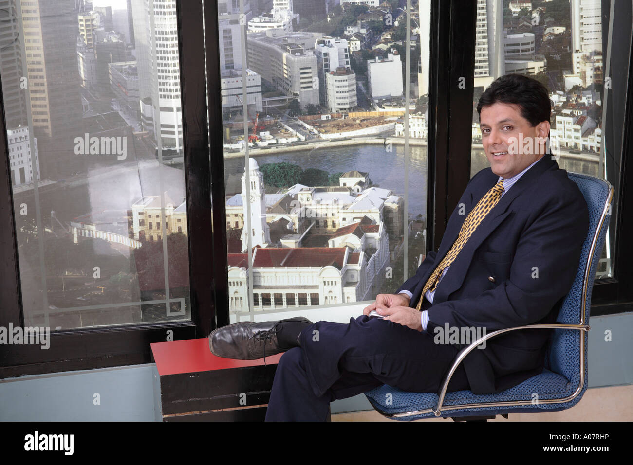 CEO sitting in his cabin in business suit with city background Stock ...