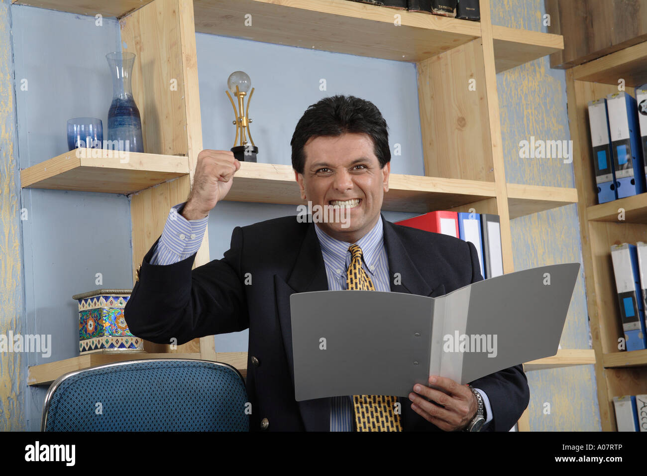 CEO happy reading report in his office cabin in business suit Stock ...