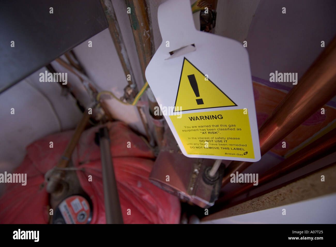 Dangerous condemned Gas appliance, household boiler and pipes with sign ...
