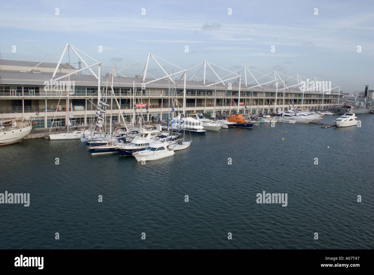 Excel exhibition centre during boat show with boats on river thames ...